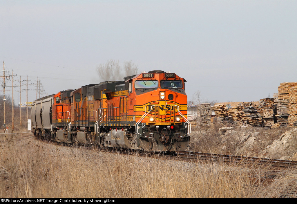 BNSF 5061 heads south with a grain train.